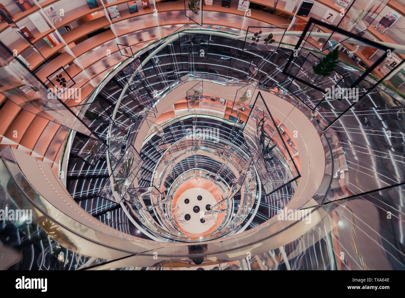 The revolving staircase of the Triple Bookstore Stock Photo - Alamy