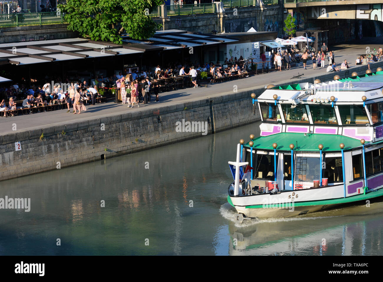 Wien, Vienna: river Donaukanal, people at quay, passenger ship in 02 ...