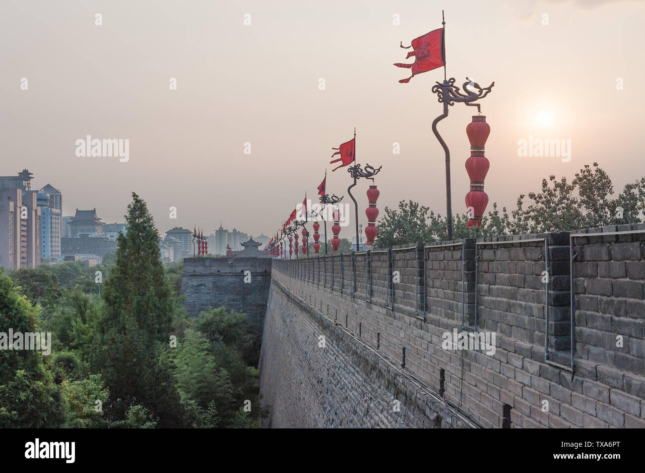 Sunset on the ancient city walls of Xi'an Stock Photo - Alamy