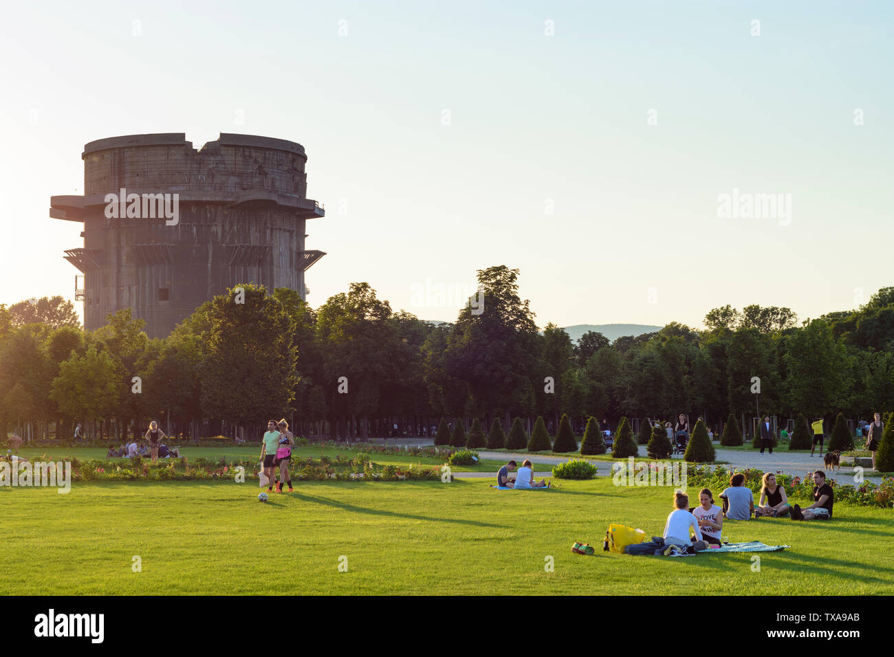 Wien, Vienna: park Augarten, flak antiaircraft gun tower, people ...