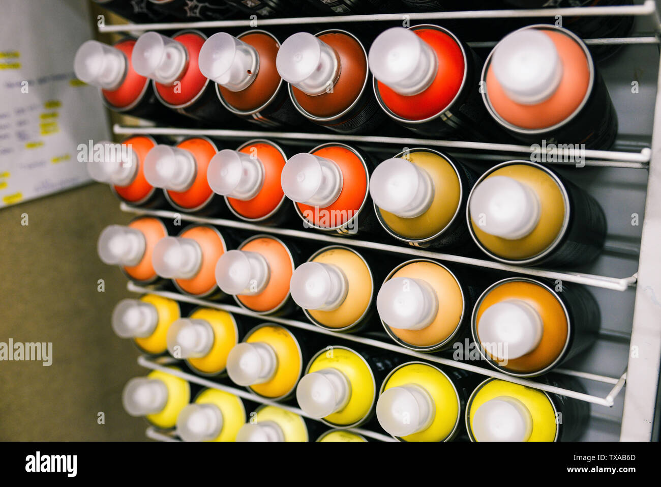 Paint cans are sold in the store. Showcase with metal cans of different ...