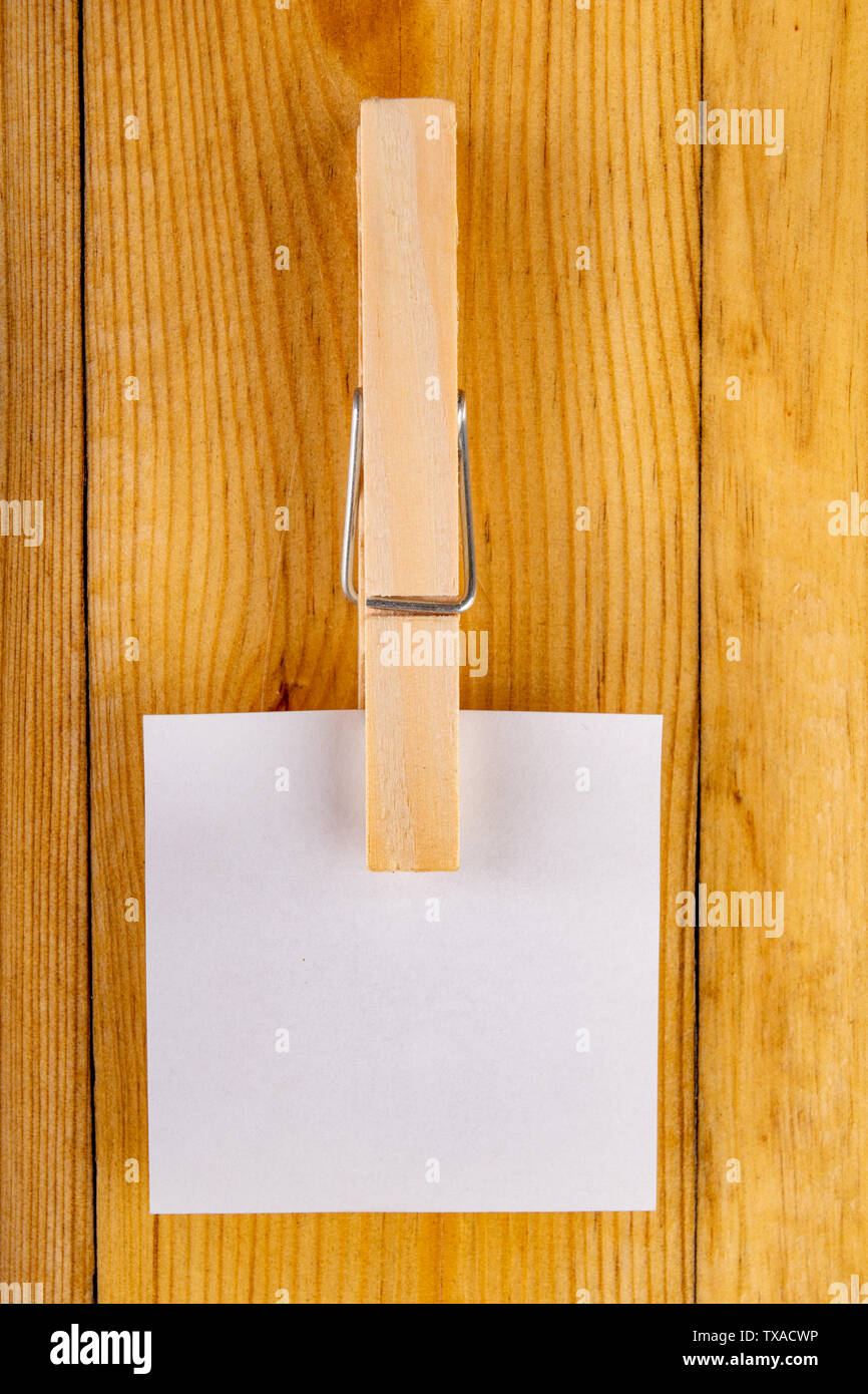 Colorful sticky notes hung on wooden clips. Sticky notes for saving ...