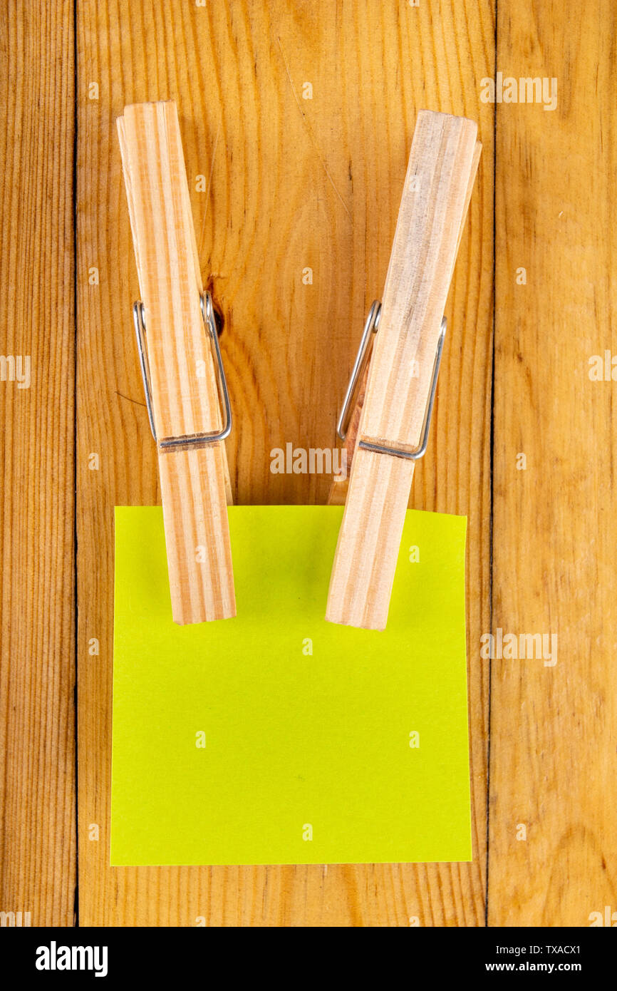 Colorful sticky notes hung on wooden clips. Sticky notes for saving ...
