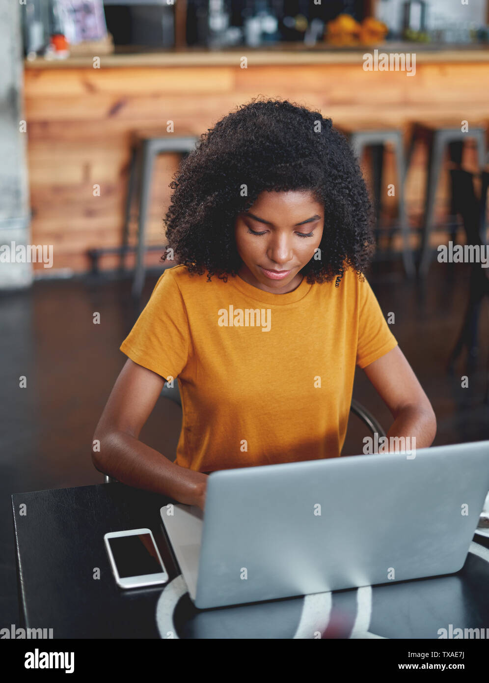 African woman laptop using smartphone hi-res stock photography and ...