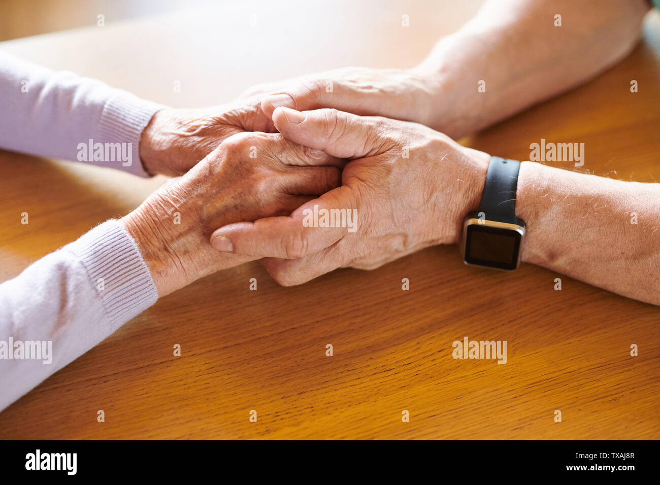 Hands of supportive mature husband holding those of his wife Stock ...