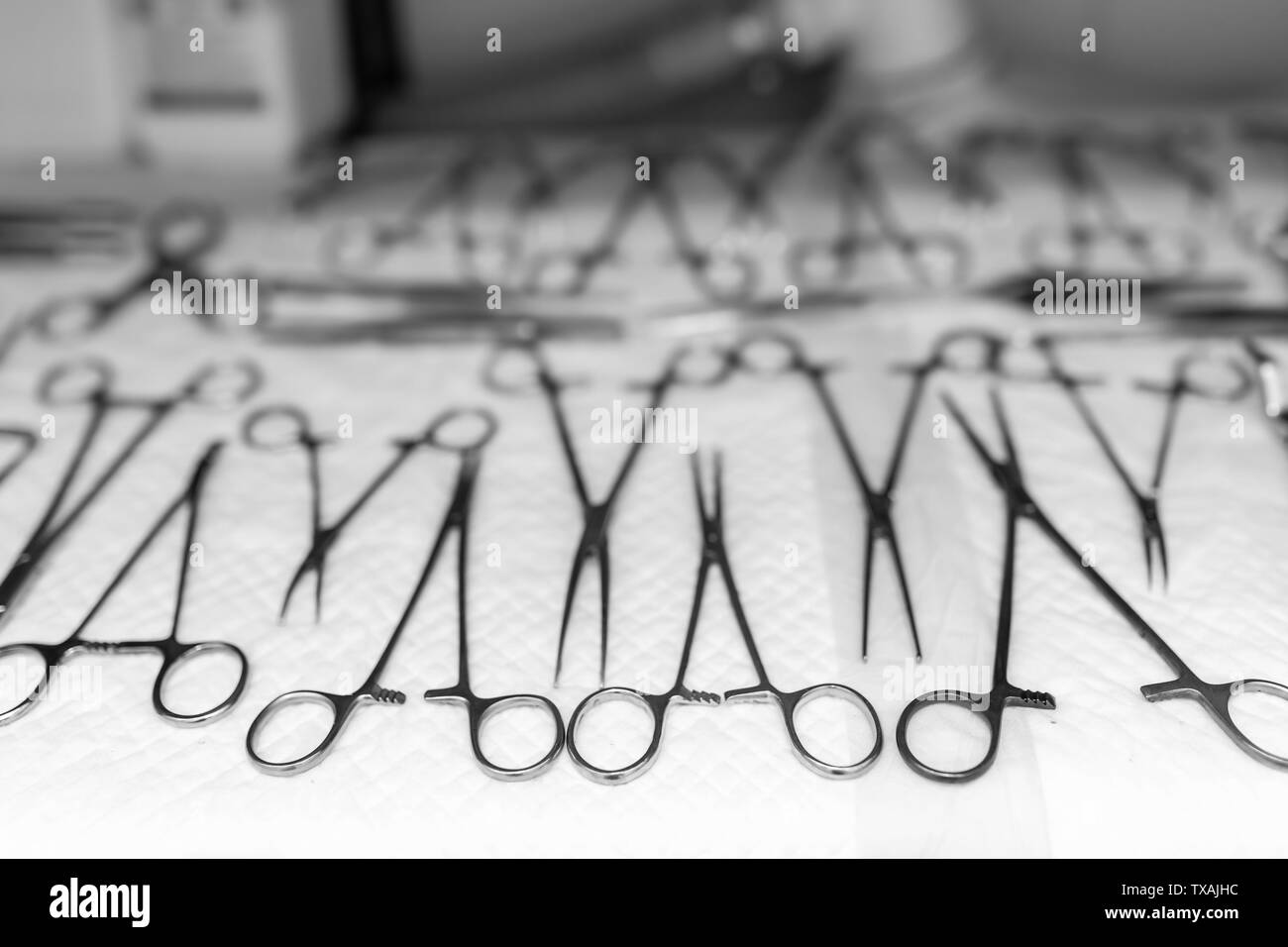 Table with surgical clamps in operatin room Stock Photo - Alamy