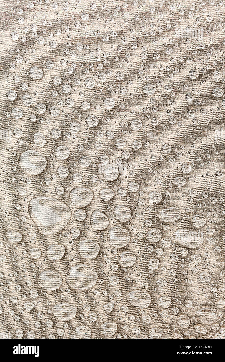 Texture of water drops on fabric textile close-up. Rain background ...