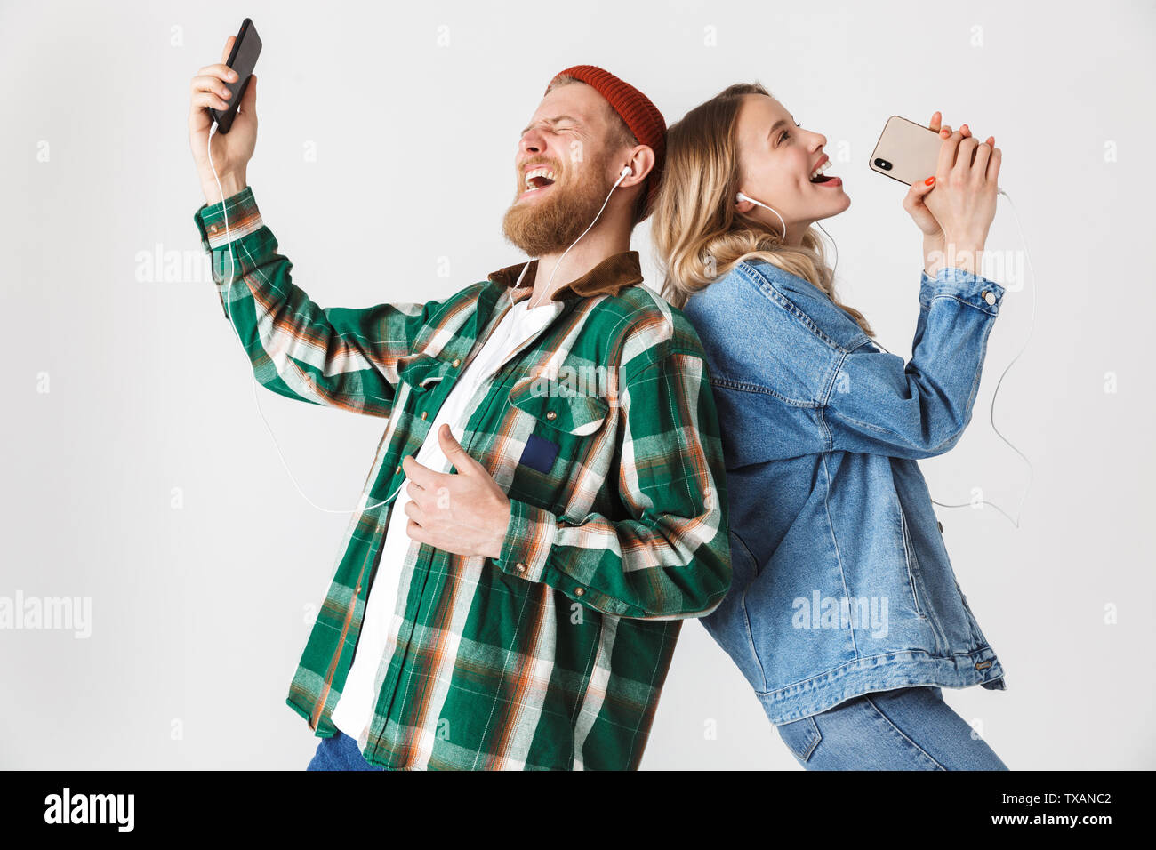Image of a happy young loving couple posing isolated over white wall ...