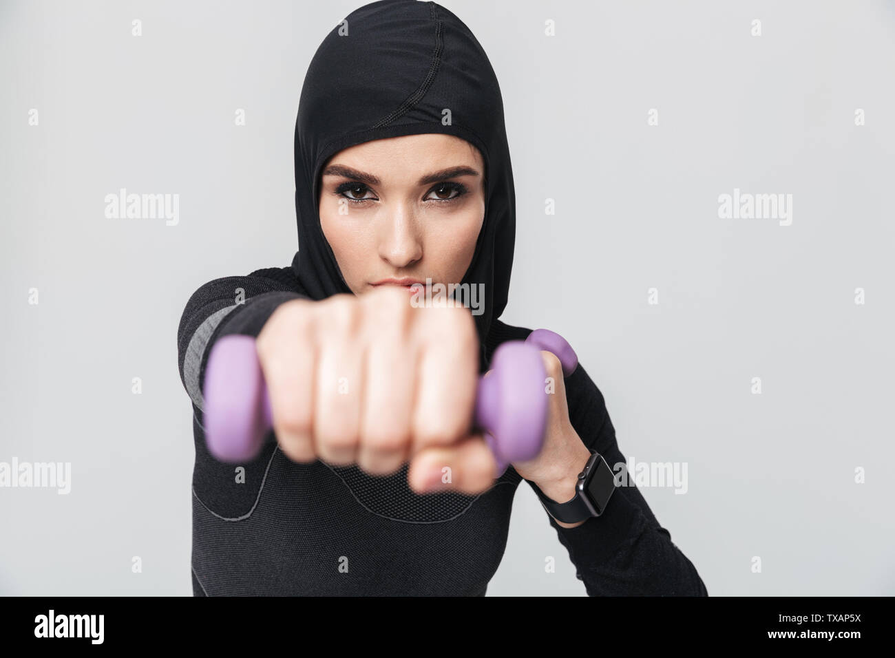 Image of young woman fitness muslim fighter boxer posing isolated over ...