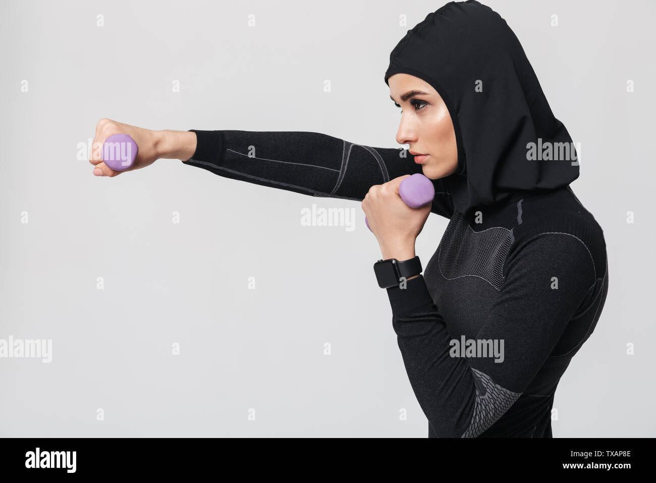 Image of young woman fitness muslim fighter boxer posing isolated over ...