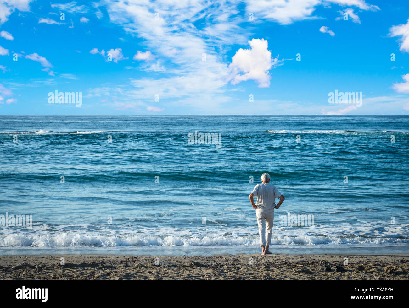 Old man staring at the sea Stock Photo - Alamy