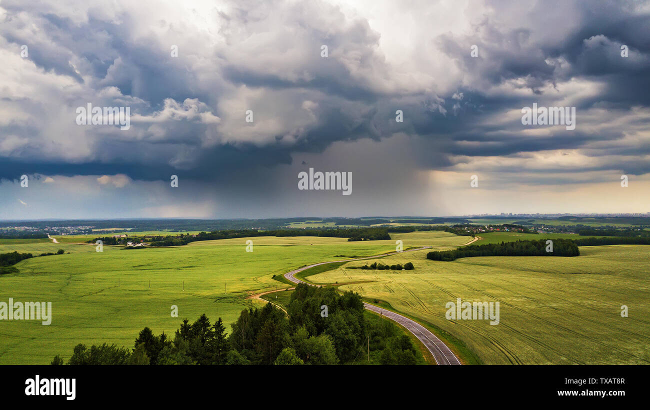 Dark clouds over field hi-res stock photography and images - Alamy