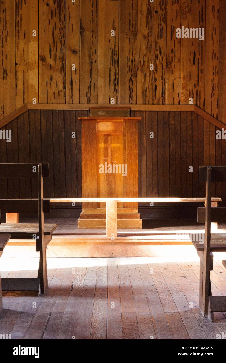 Interior of a Christian wooden church with a cross on the stand Stock ...