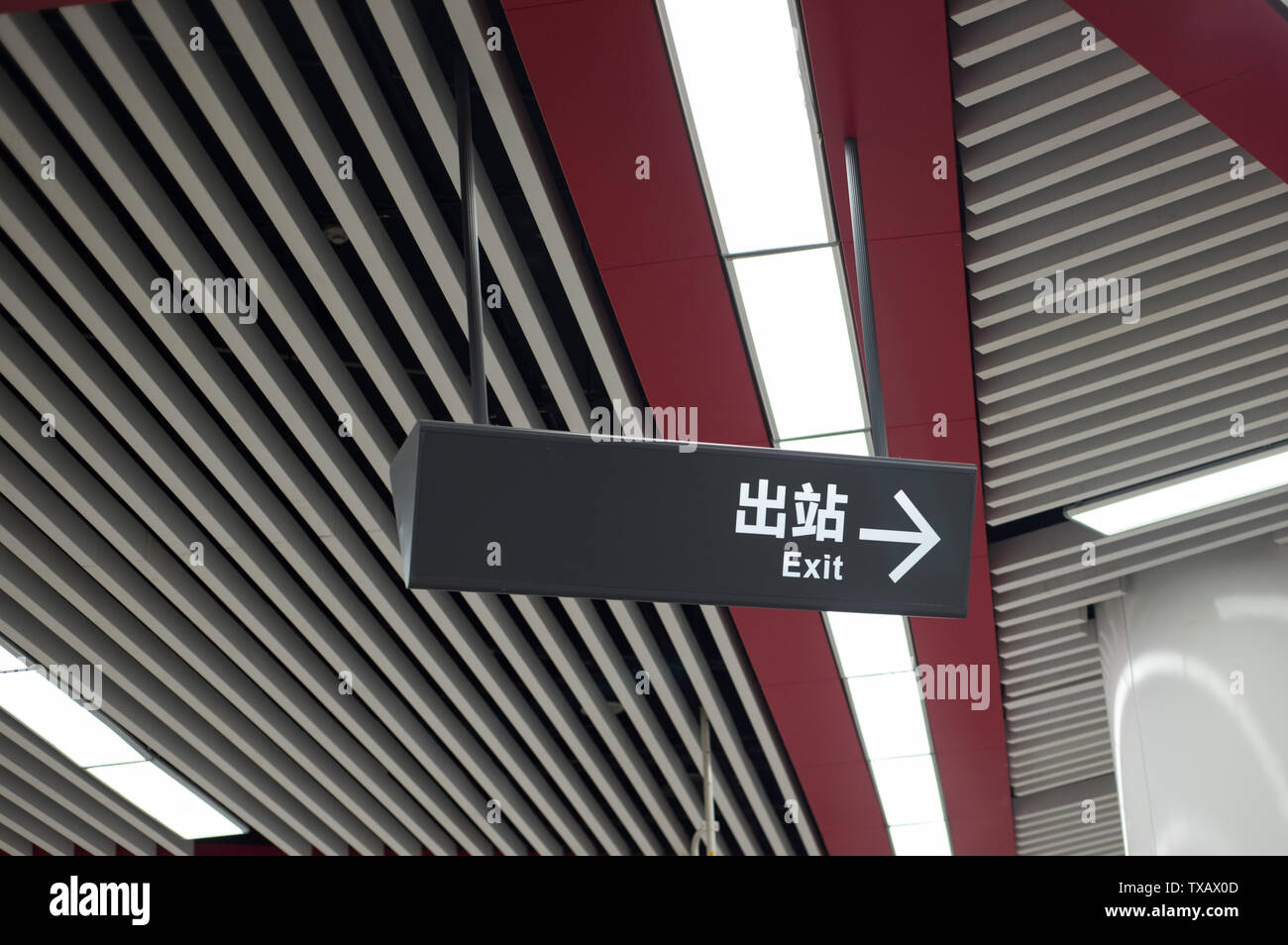 The subway station exit points to the sign Stock Photo - Alamy