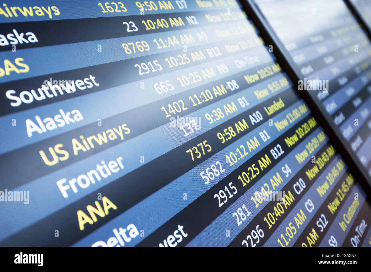 info of flight on billboard in airport Stock Photo - Alamy