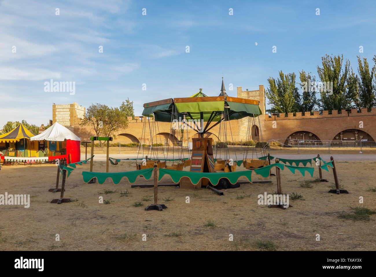 ancient wooden carousel in a medieval festival celebrated in alcala de ...