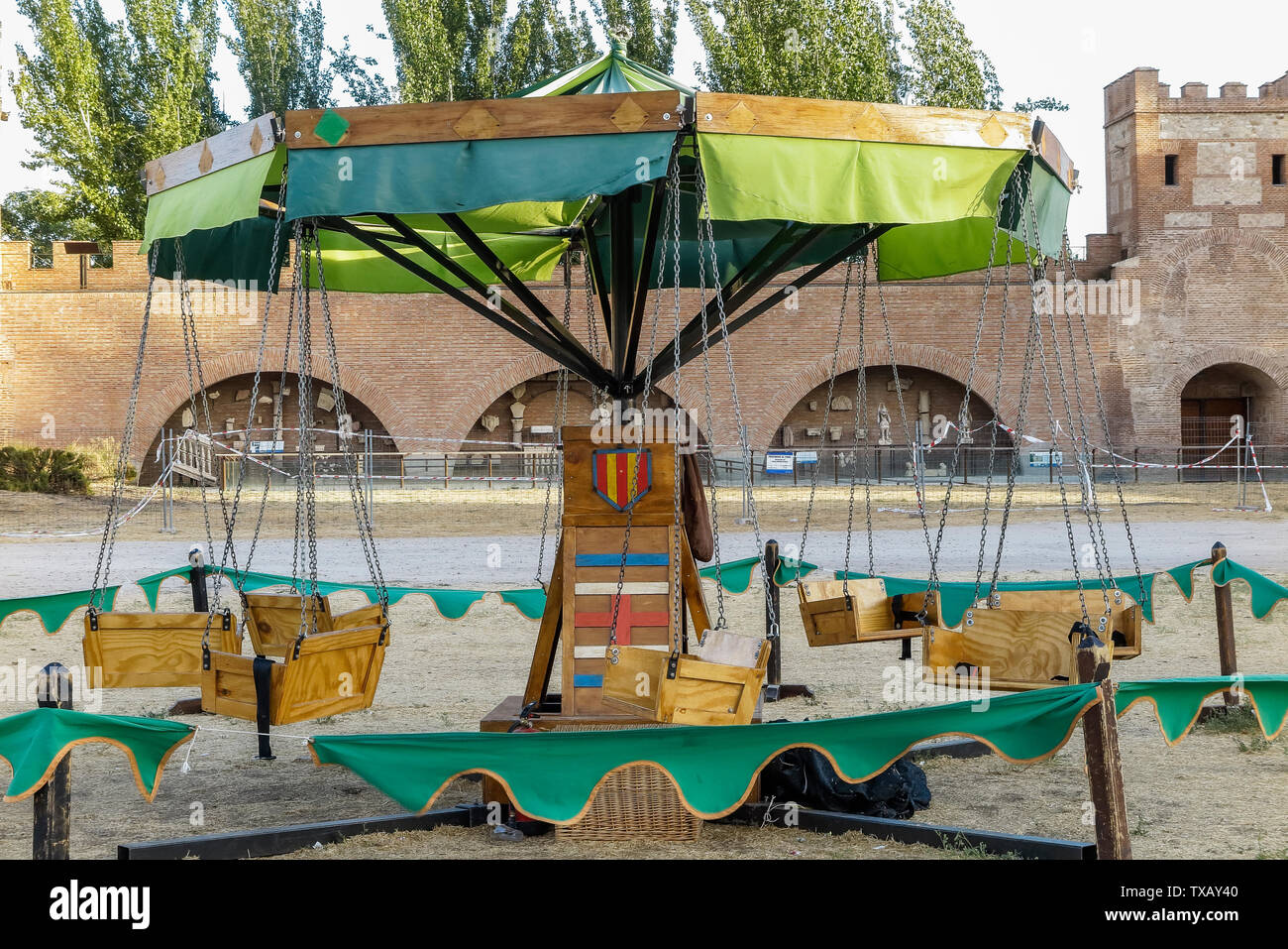 ancient wooden carousel in a medieval festival celebrated in alcala de ...