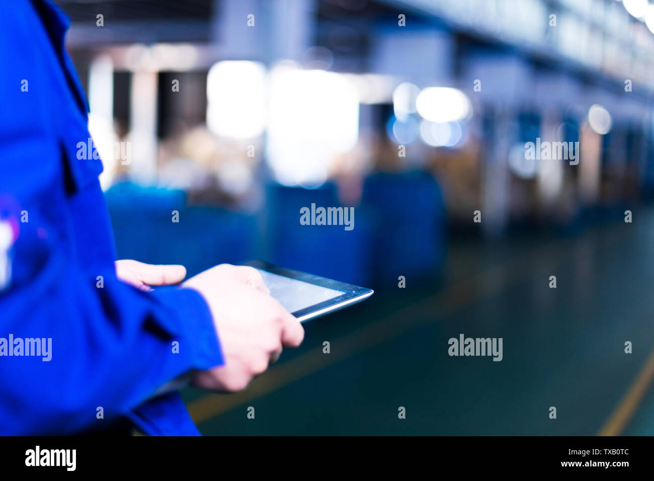 Hand tablet in factory Stock Photo - Alamy