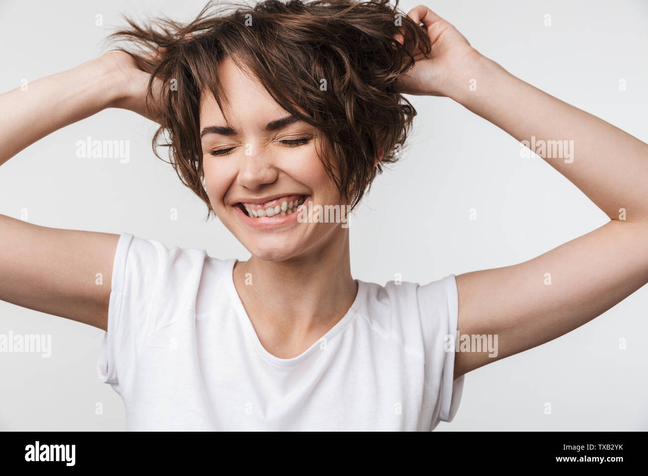 Image of a beautiful young pretty excited happy woman posing isolated ...