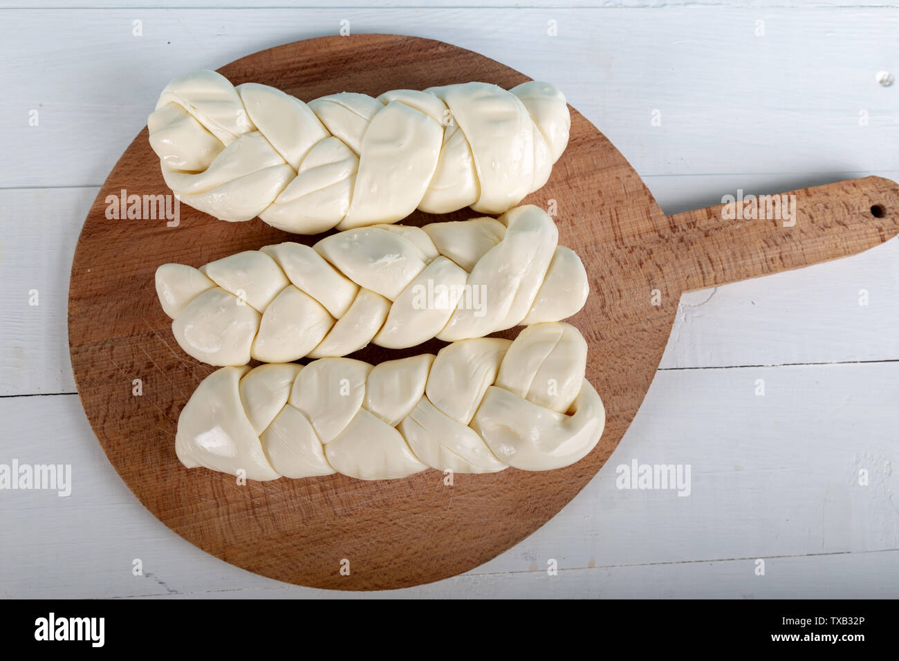 Turkish knitting cheese on wooden background Stock Photo - Alamy