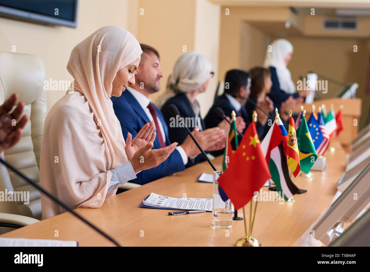 Group of contemporary intercultural delegates clapping hands Stock ...