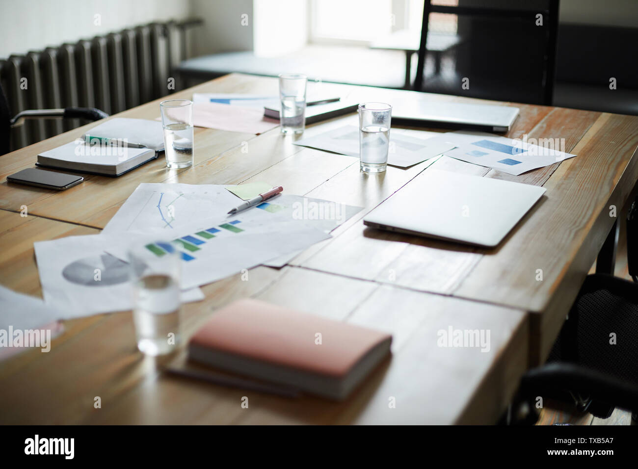 Background image of modern office interior with documents on wooden ...
