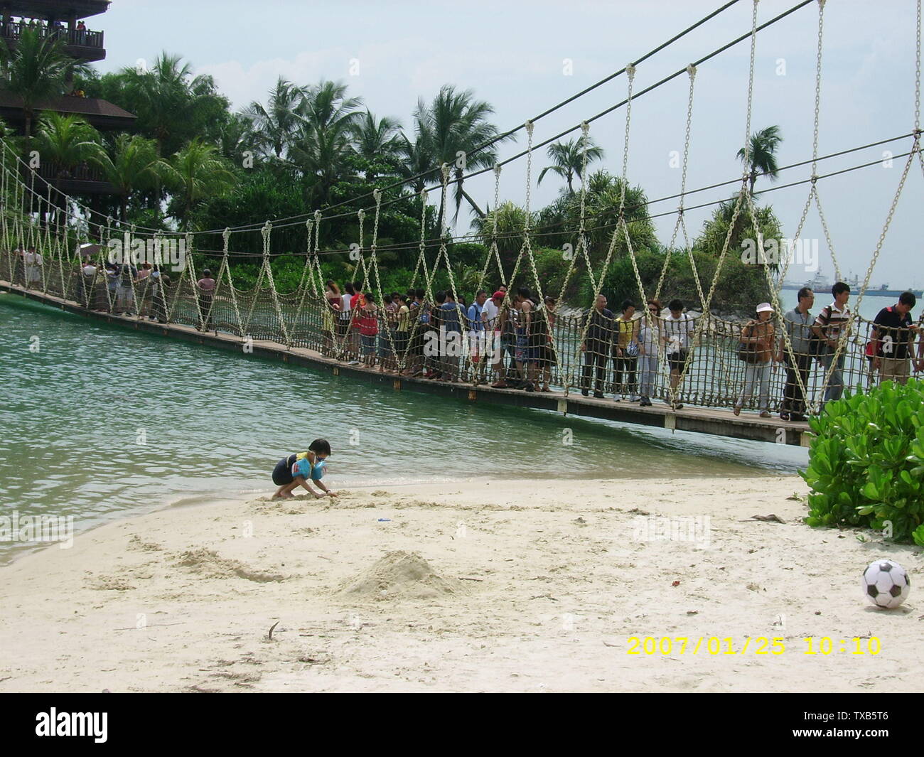 The suspension bridge linking palawan beach in sentosa hi-res stock ...