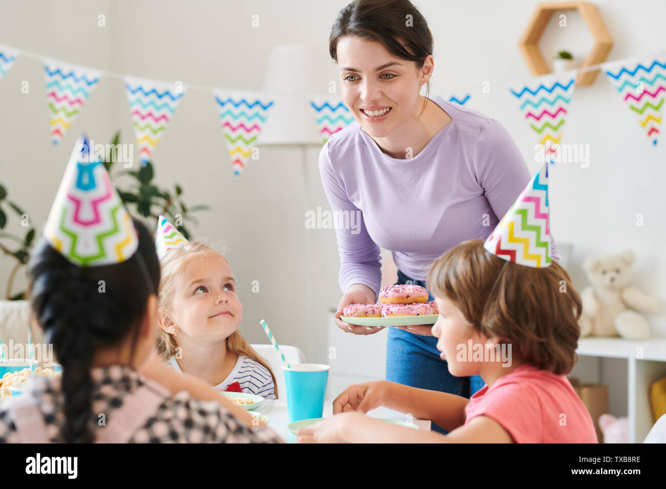 Woman bending over table hi-res stock photography and images - Alamy