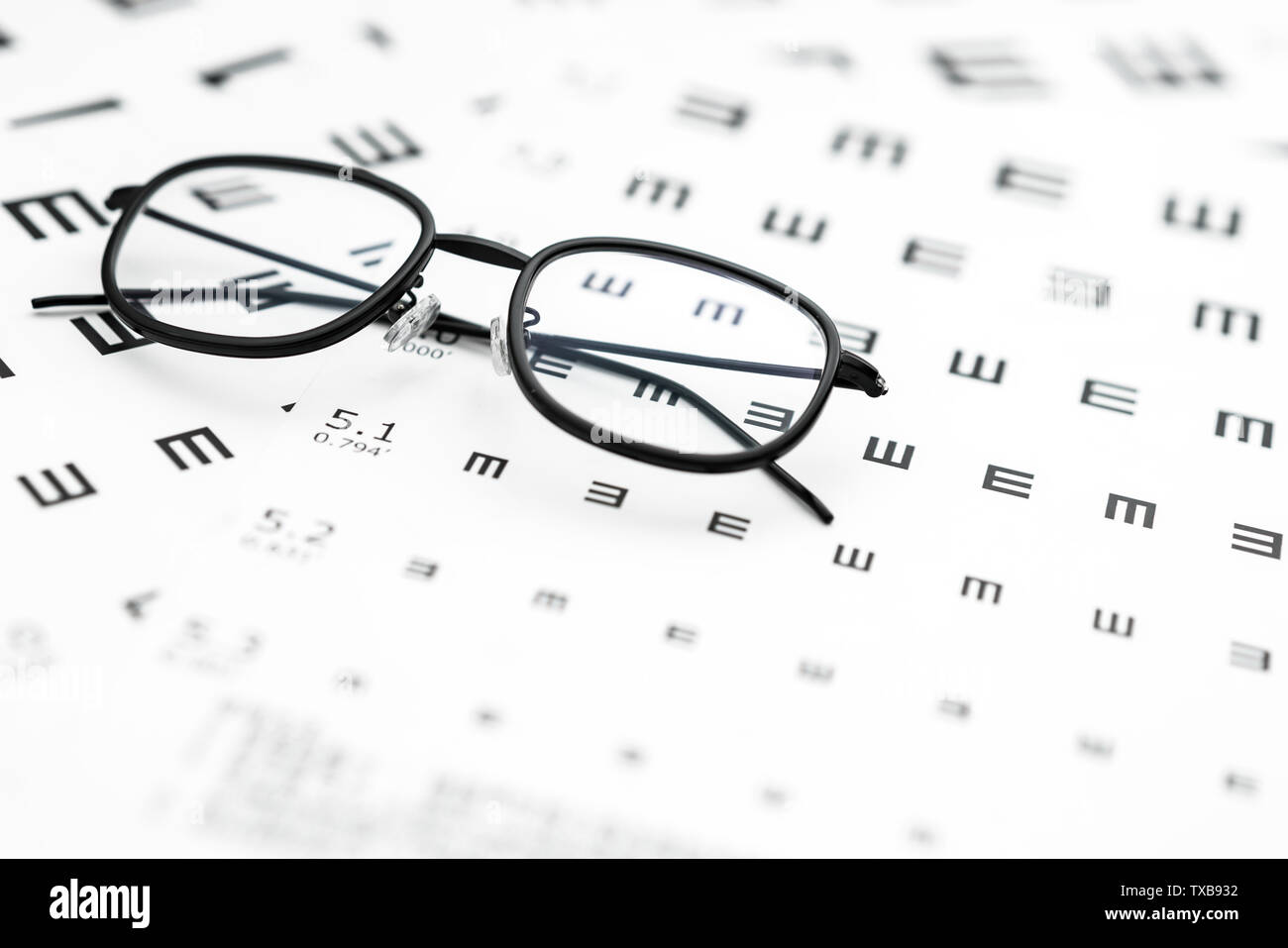 Black glasses and visual meter on white background Stock Photo - Alamy