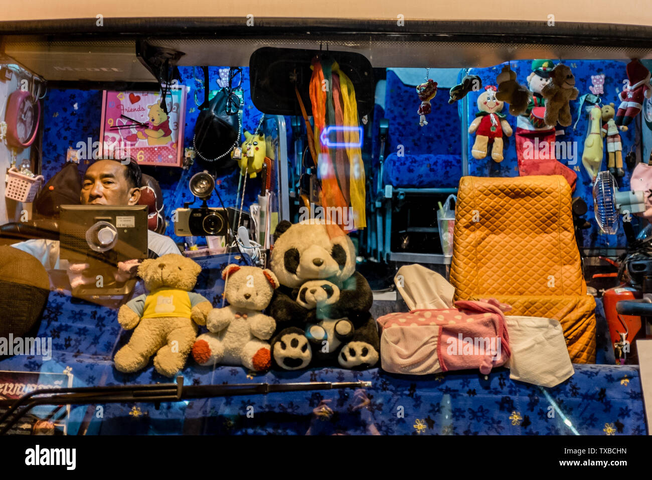 Bangkok, Thailand. 3rd June, 2018. Bus driver with lots of dolls ...