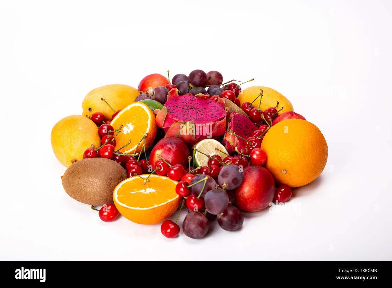Colorful delicious fresh fruit on white background Stock Photo - Alamy