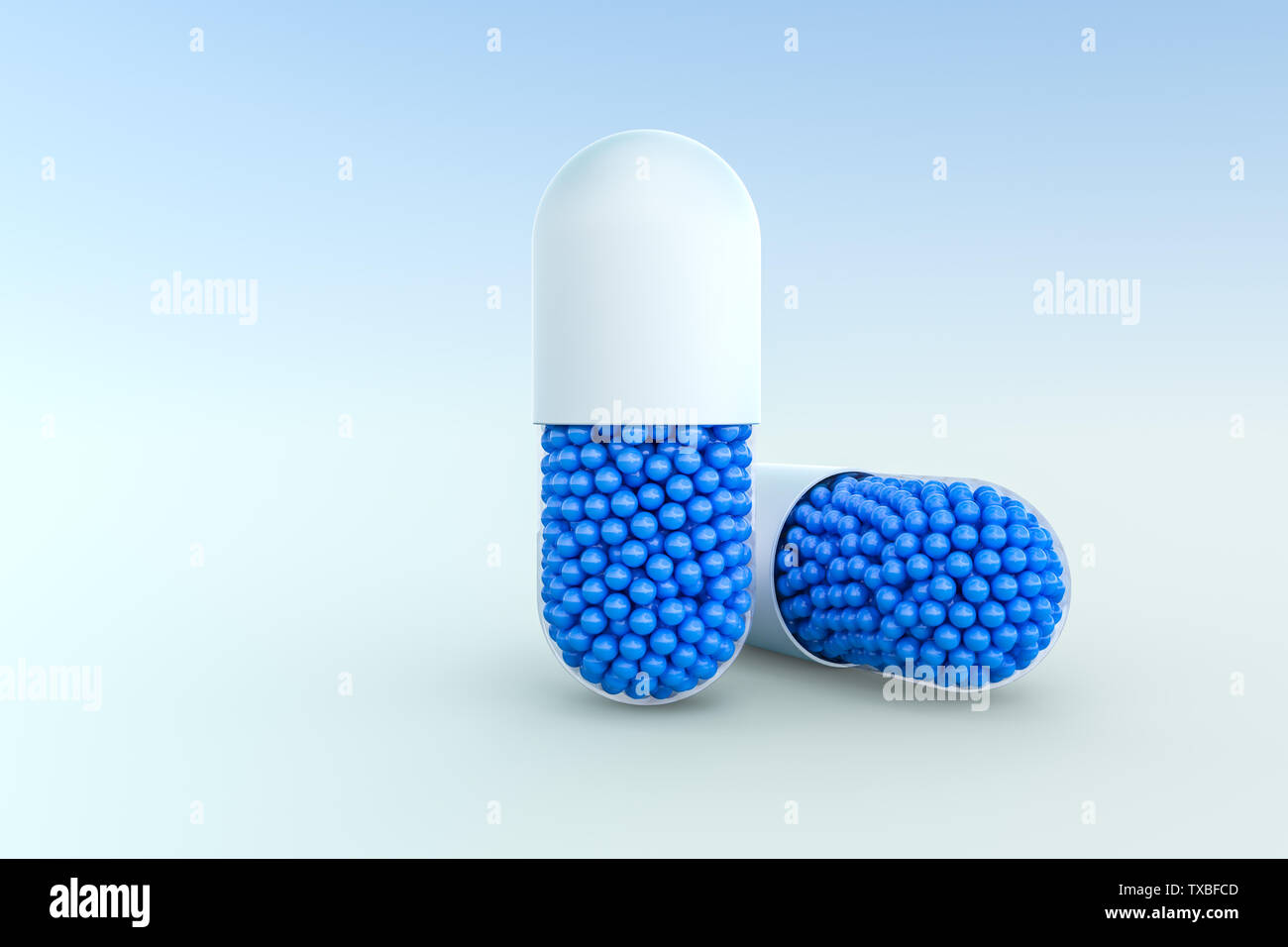 Blue granular capsule, 3-D rendering Stock Photo - Alamy