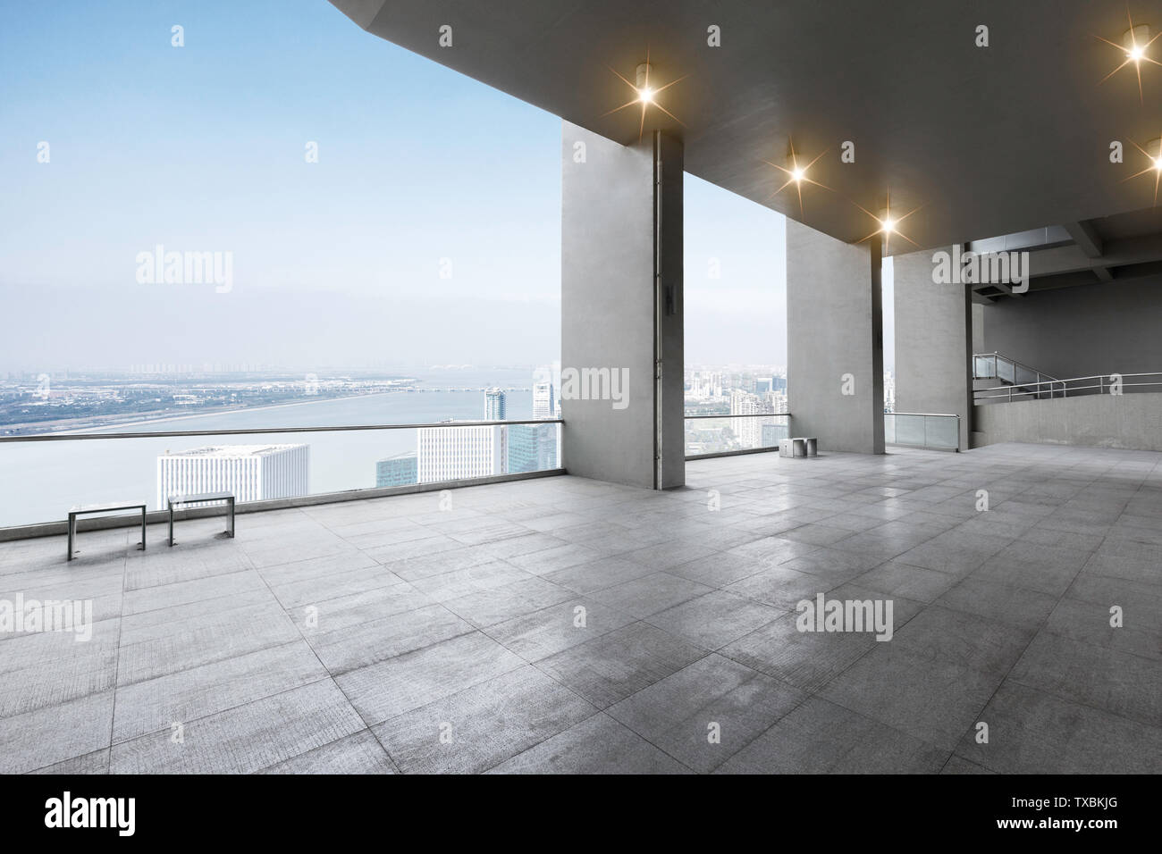 Empty patio near river Stock Photo - Alamy