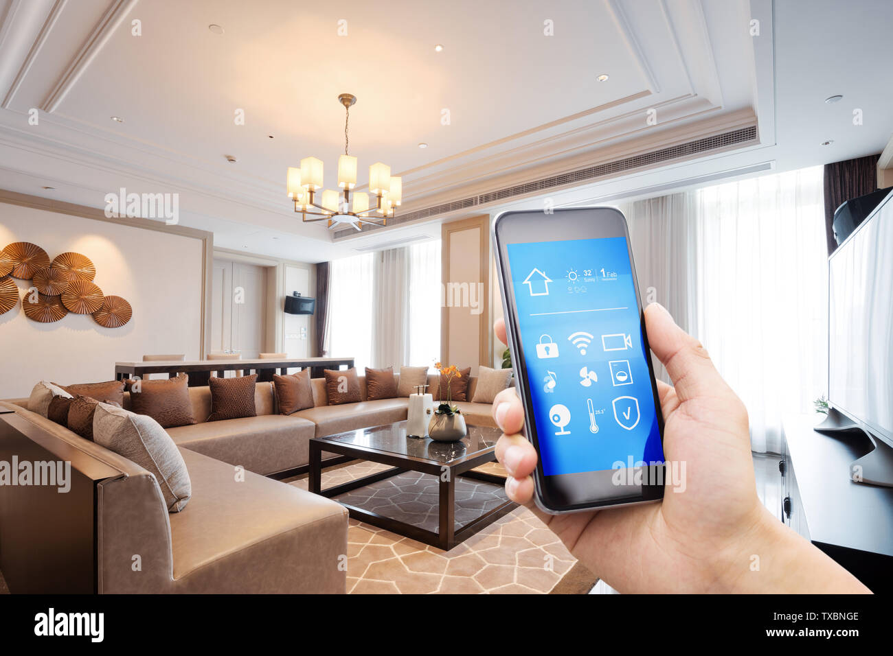 Mobile phone in smart home Stock Photo - Alamy