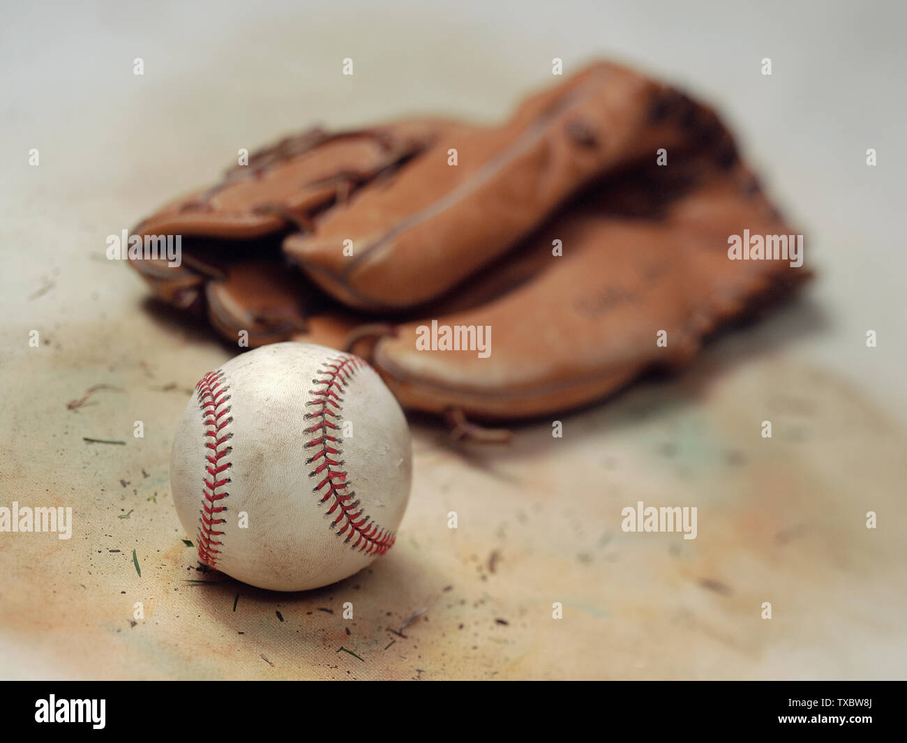 Worn and scuffed baseball and mitt on vintage canvas background with ...