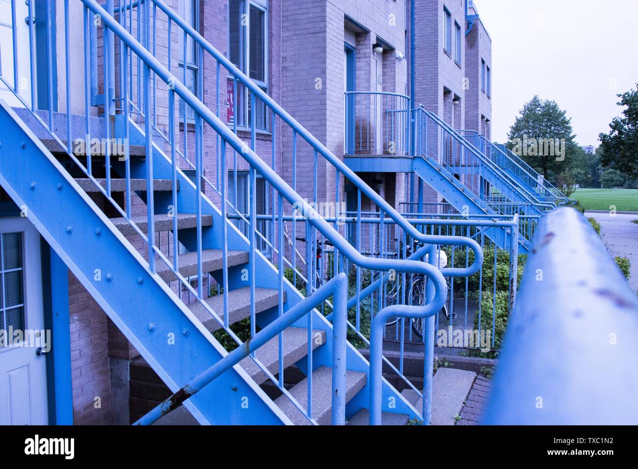 Blue metal building entrance stairs in university campus Stock Photo ...