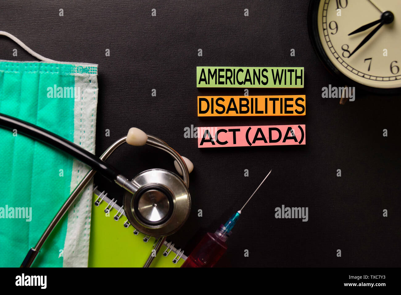 Americans with Disabilites Atc (ADA) text on top view black table with ...