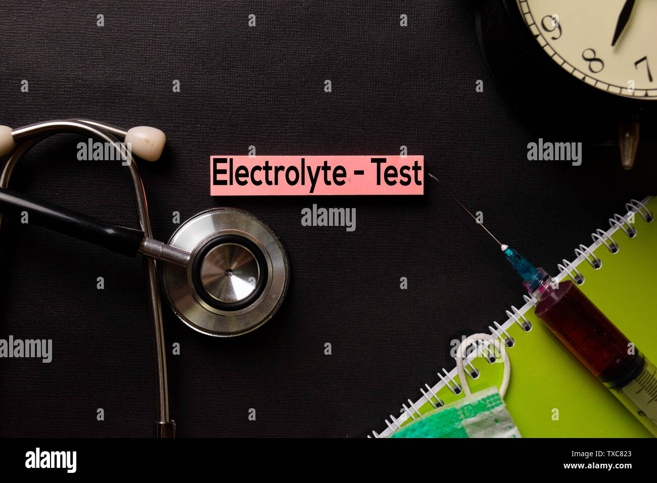 Electrolyte - Test text on top view black table with blood sample and ...