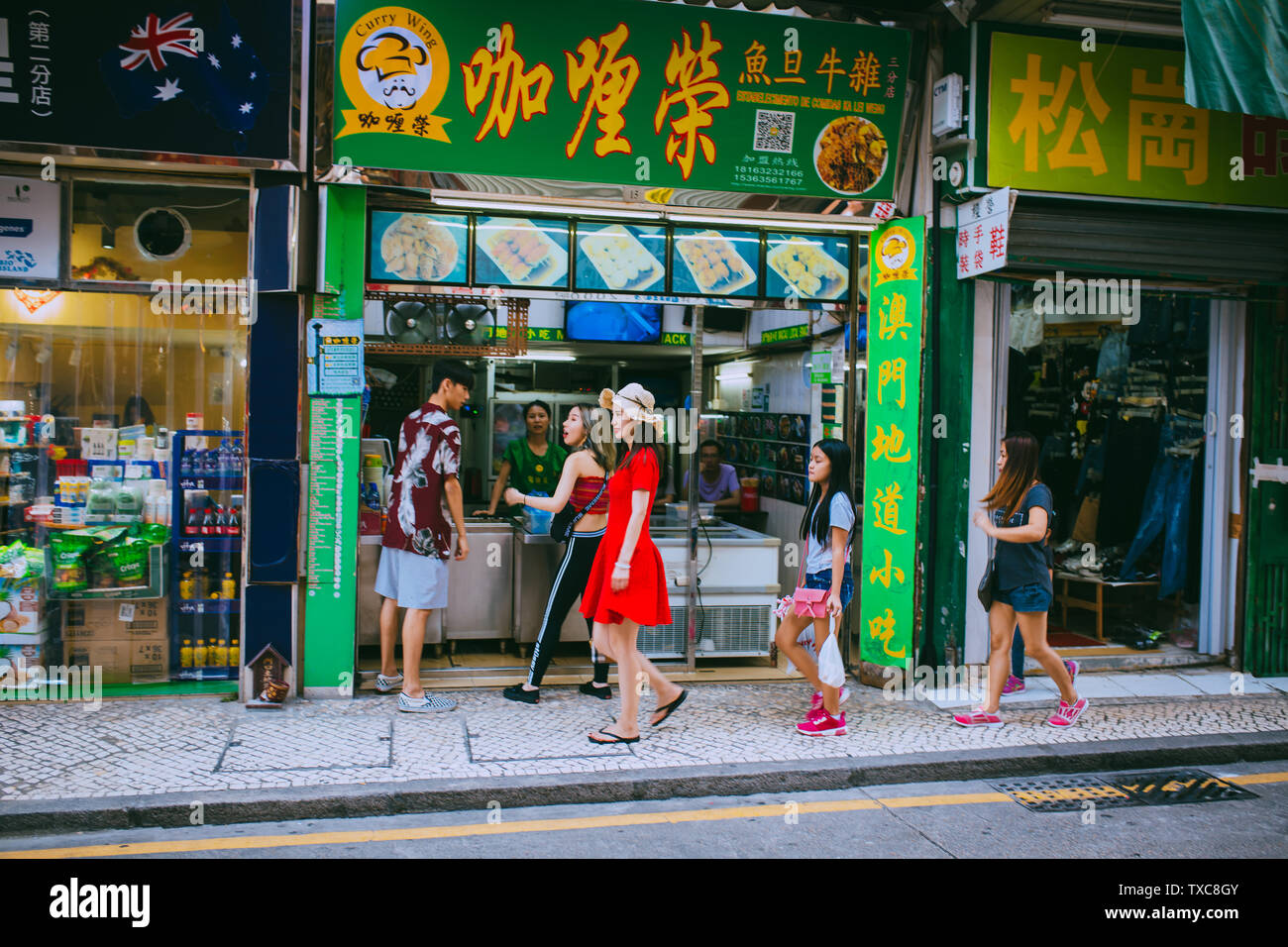 Red dress tour the big three buses Stock Photo - Alamy