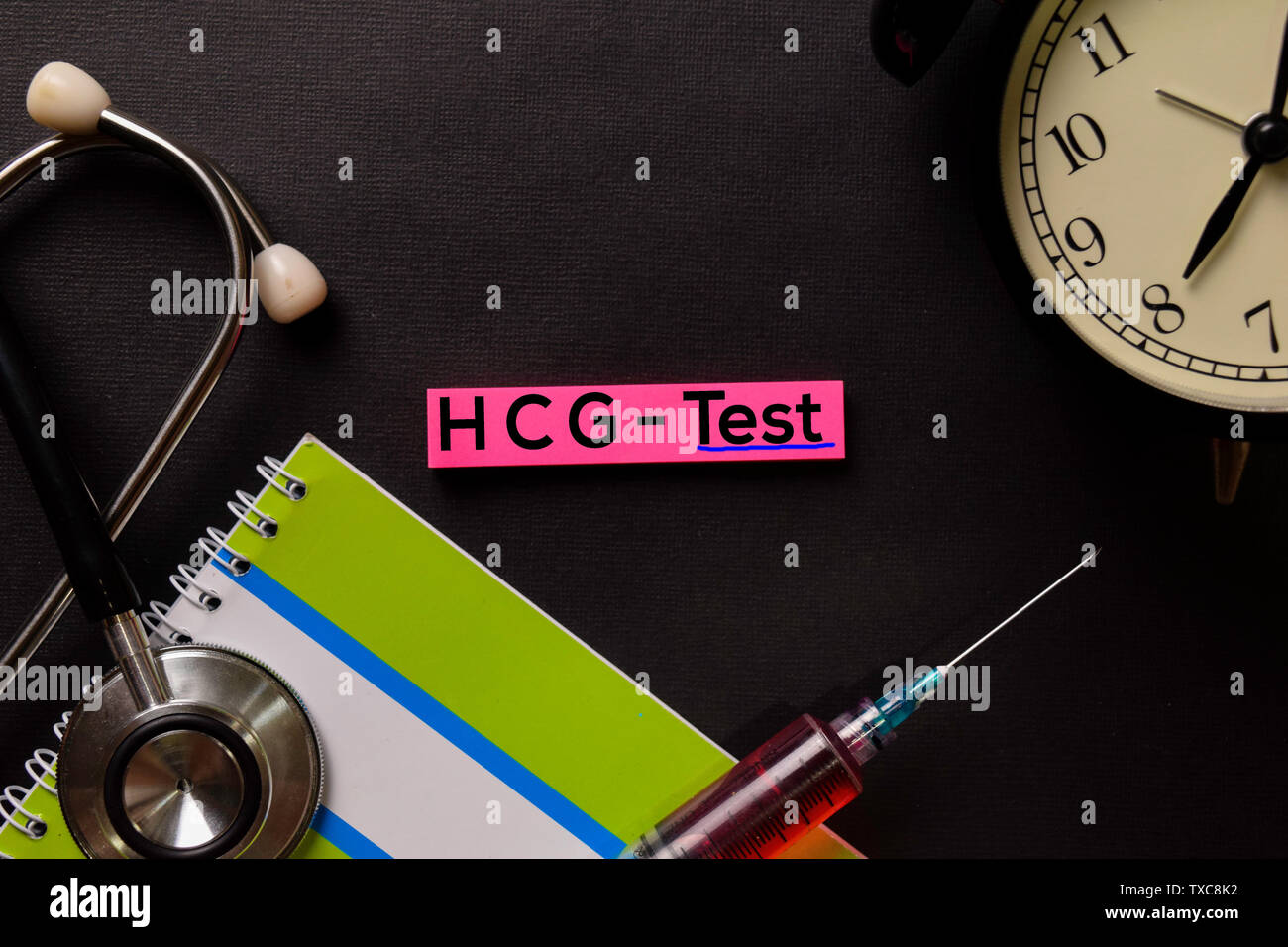 HCG - Test on top view on top view black table with blood sample and ...