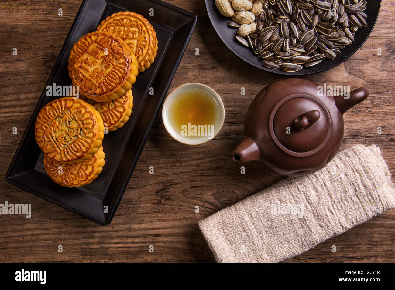 Mid-Autumn Festival melon seeds moon cake tea Stock Photo - Alamy