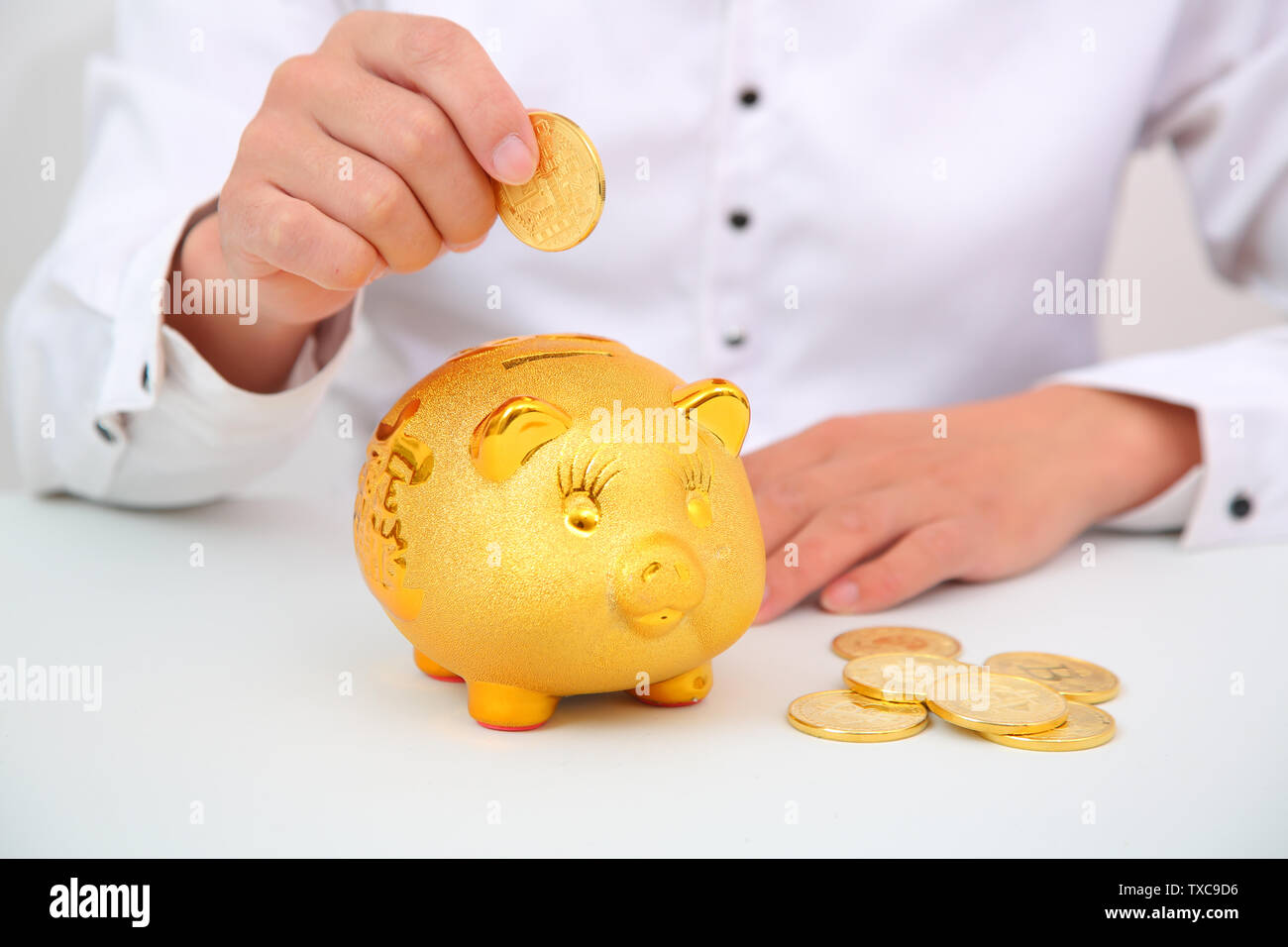 Savings pot gold coins Stock Photo - Alamy