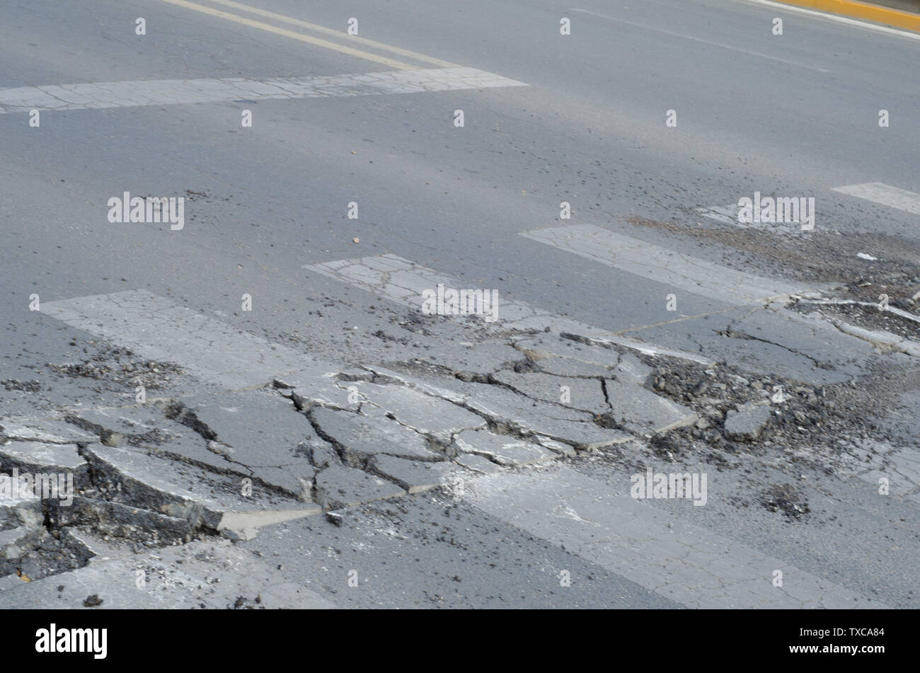 Broken asphalt road Stock Photo - Alamy