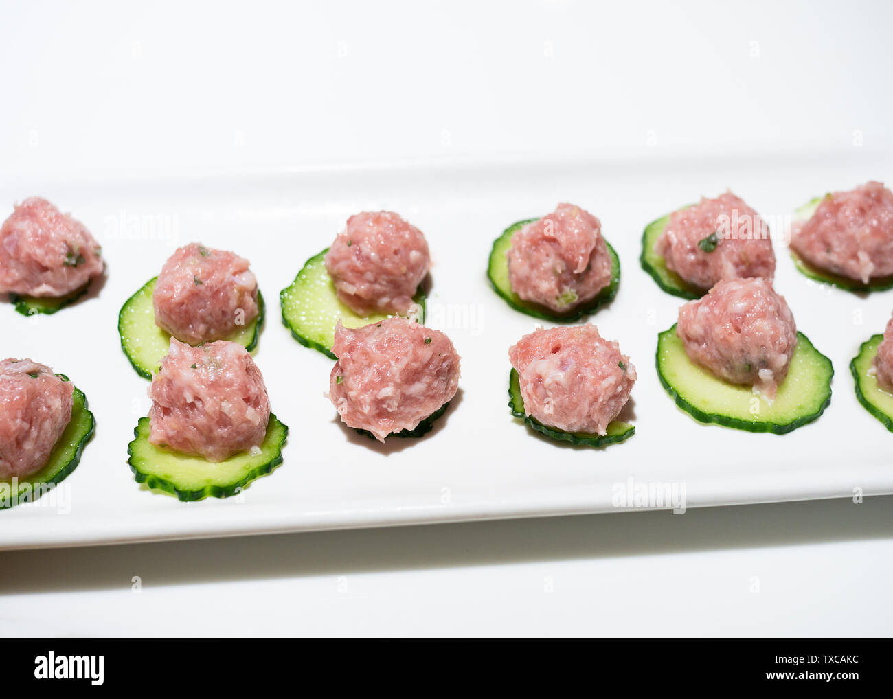 Hot pot side dish cilantro meatballs Stock Photo - Alamy