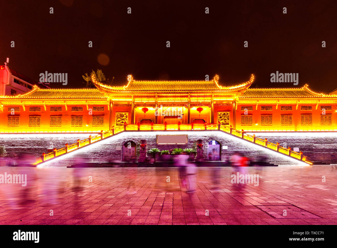 ancient building with crowded square at night Stock Photo - Alamy