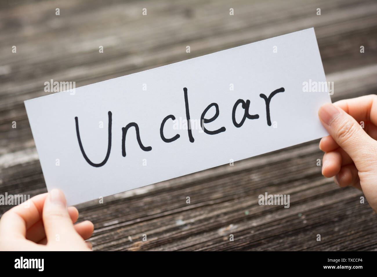 Reynolds card with text on old wood plate Stock Photo - Alamy