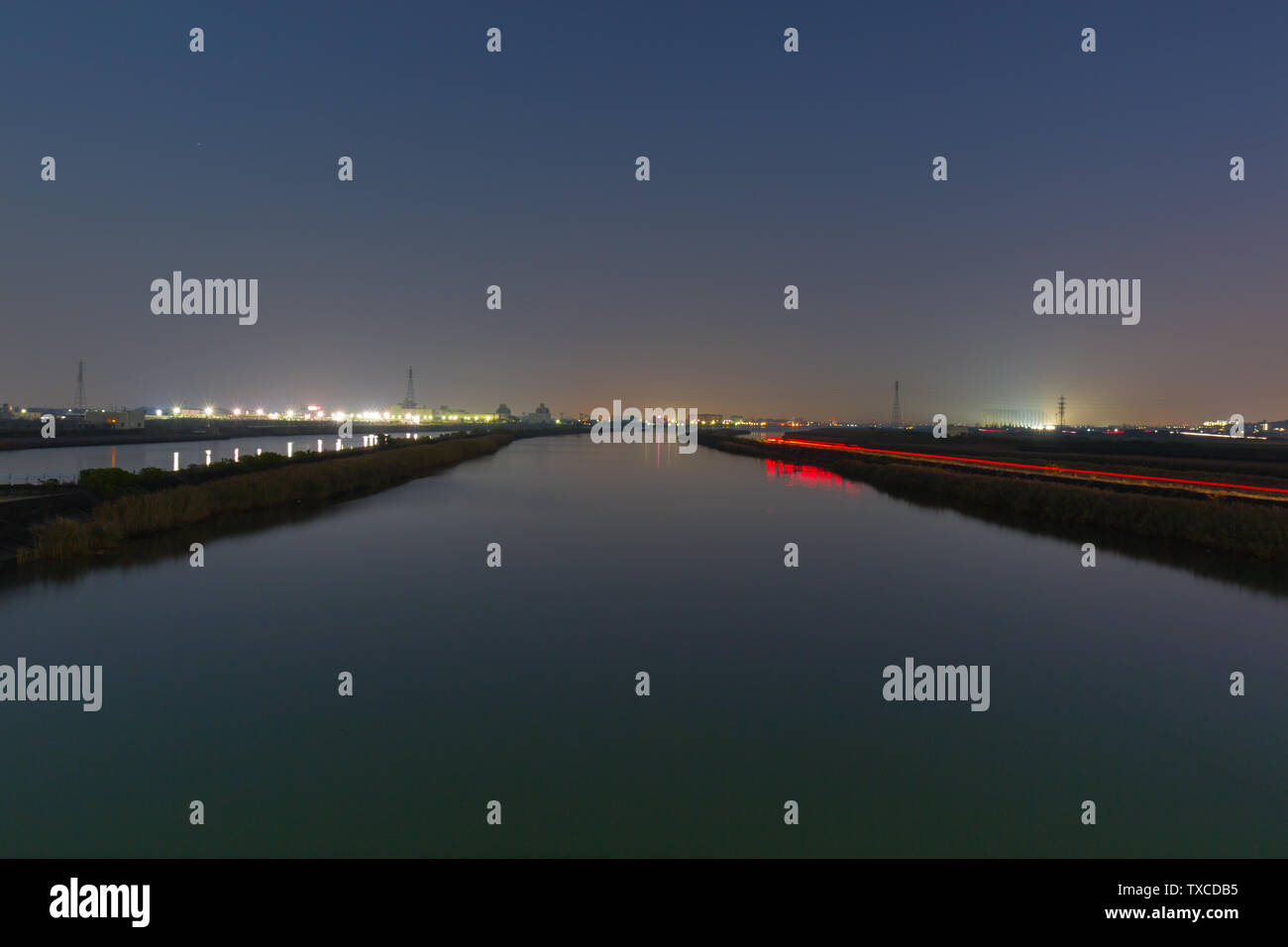 Landscape of countryside with river at dusk time Stock Photo - Alamy