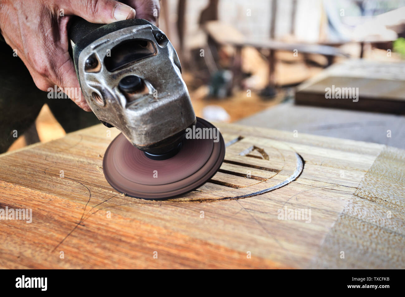 Wood worker carving wood Stock Photo - Alamy