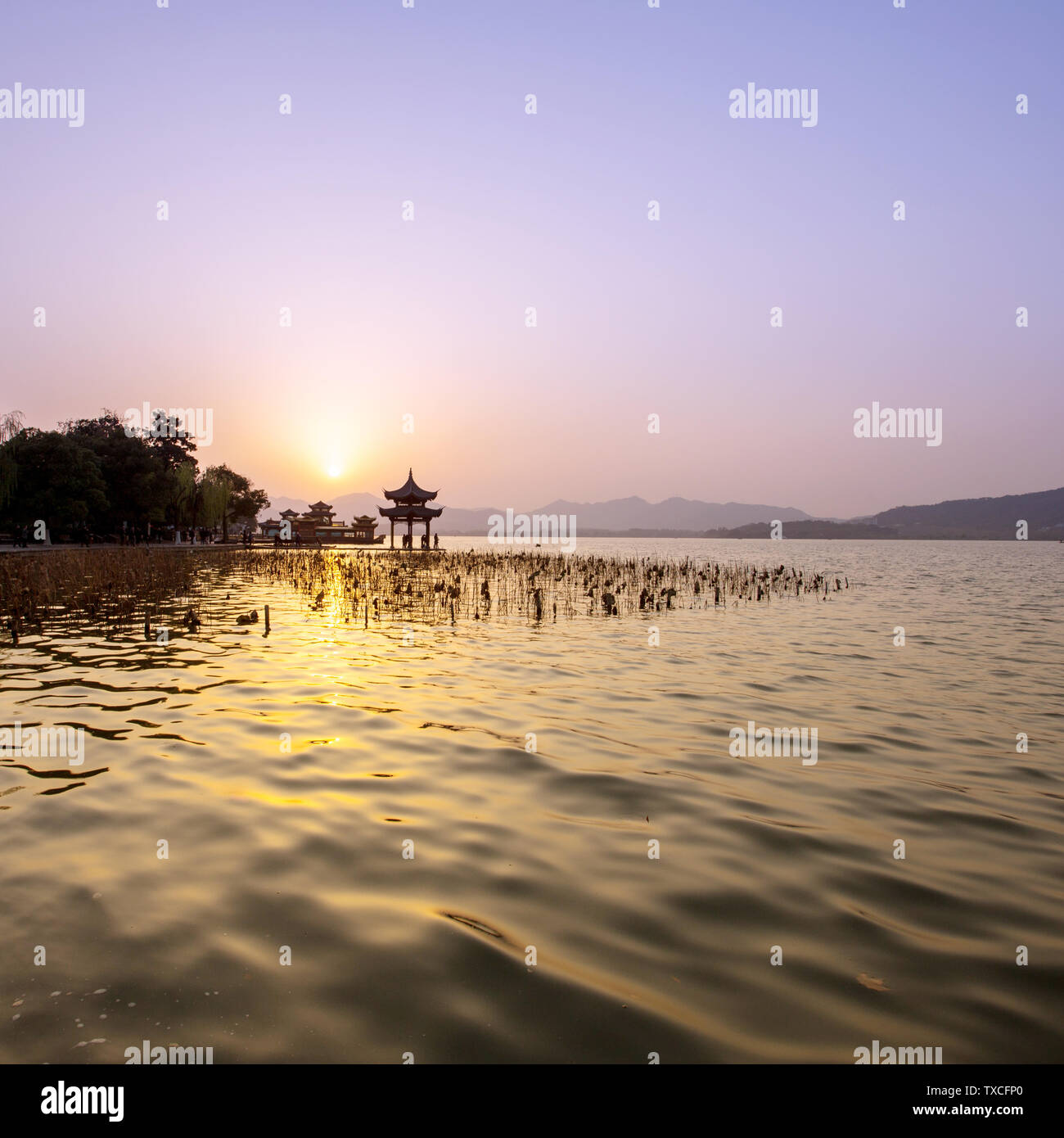 skyline and lake at sunset in hangzhou,china Stock Photo - Alamy
