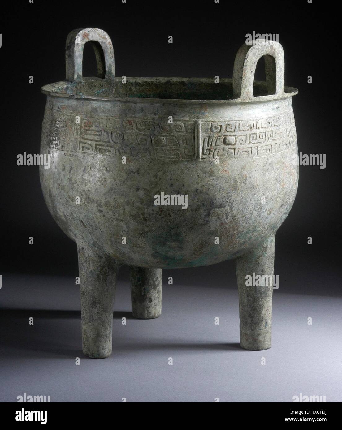 Ritual food cauldron ding with masks hi-res stock photography and ...